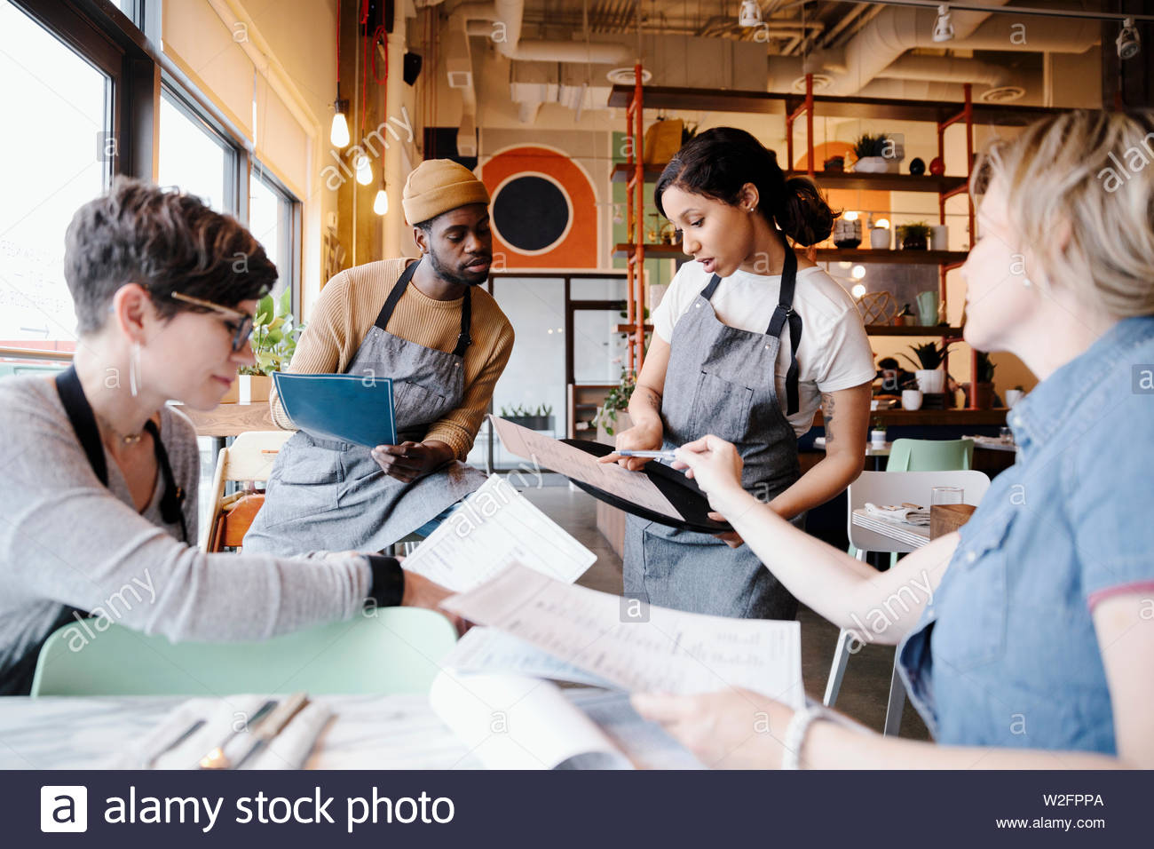 Waiter explaining menu hi-res stock photography and images - Alamy