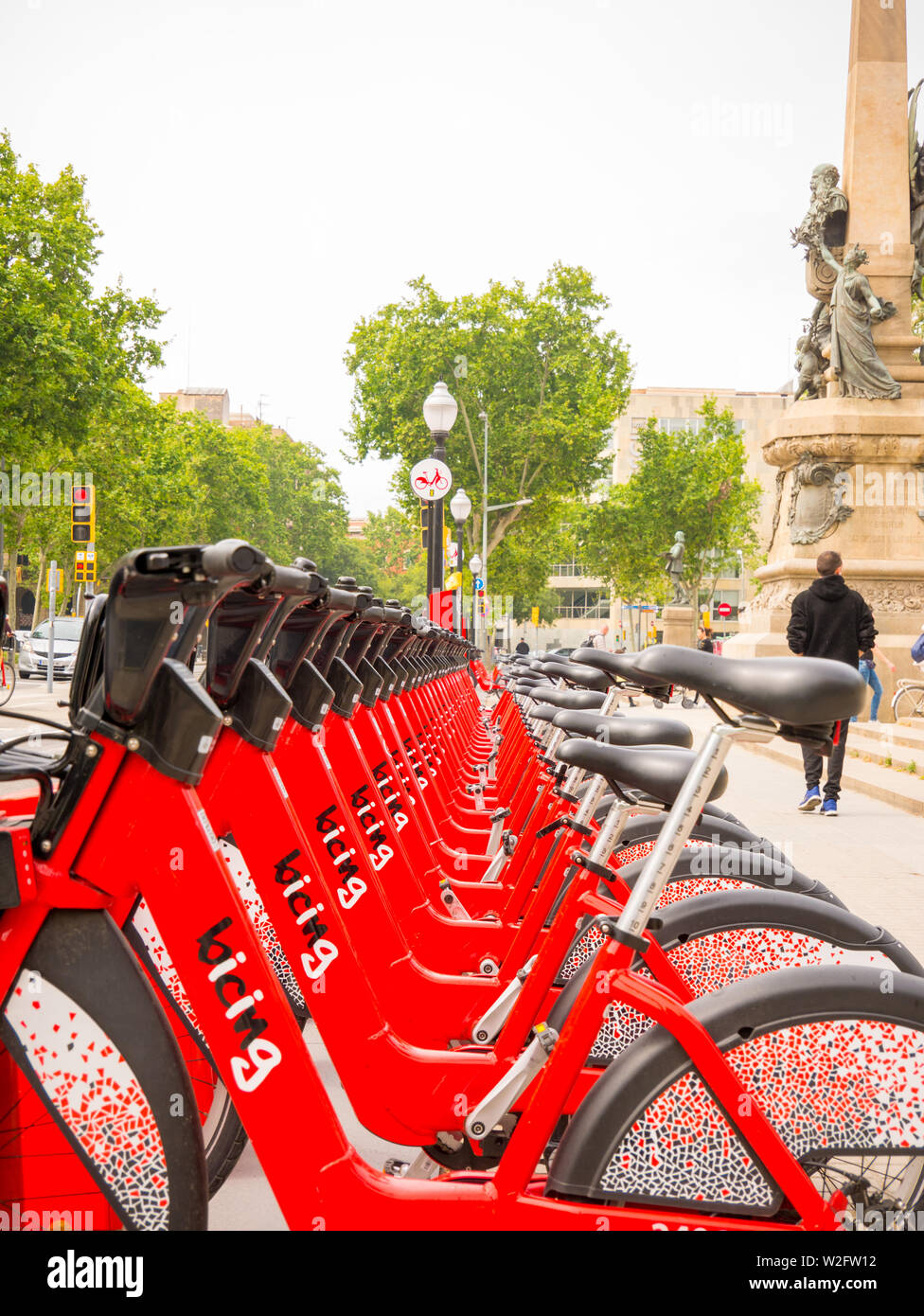 Barcelona, Spain. May 2019 : Row of red bicycles in a bike rack ...