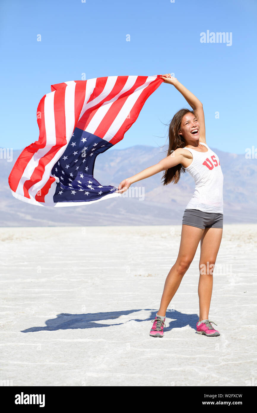 US flag - woman athlete showing american flag. USA sport athlete winner ...