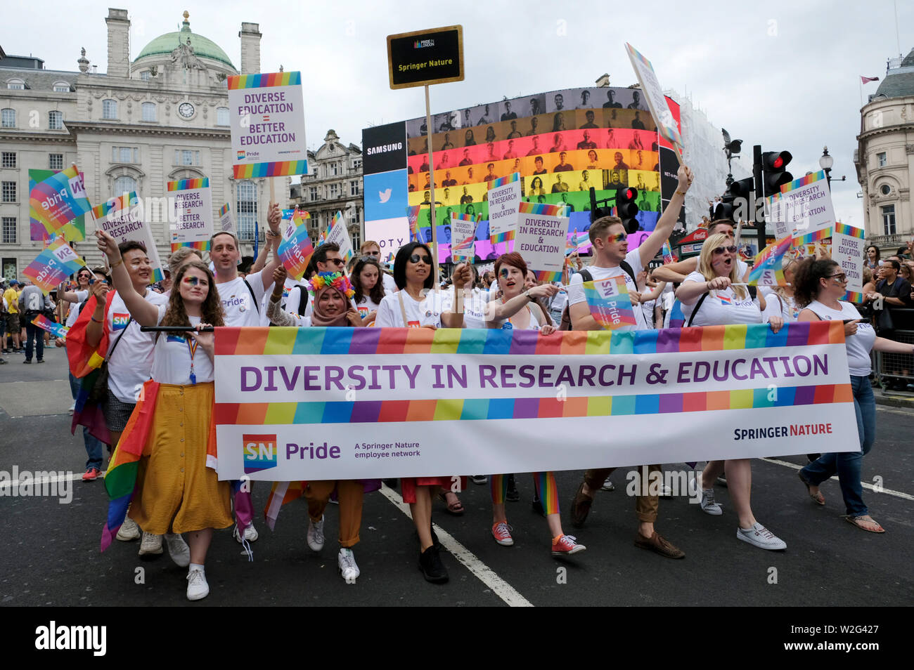 Participants march with a banner during the Pride.Thousands of ...