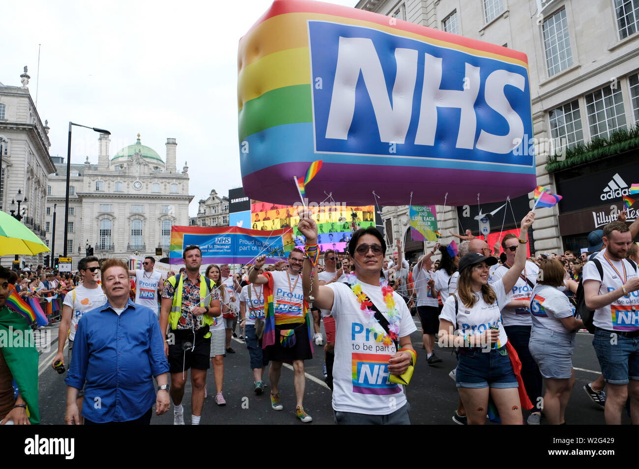 NHS Staff march with a huge NHS rainbow inflatable during the Pride ...