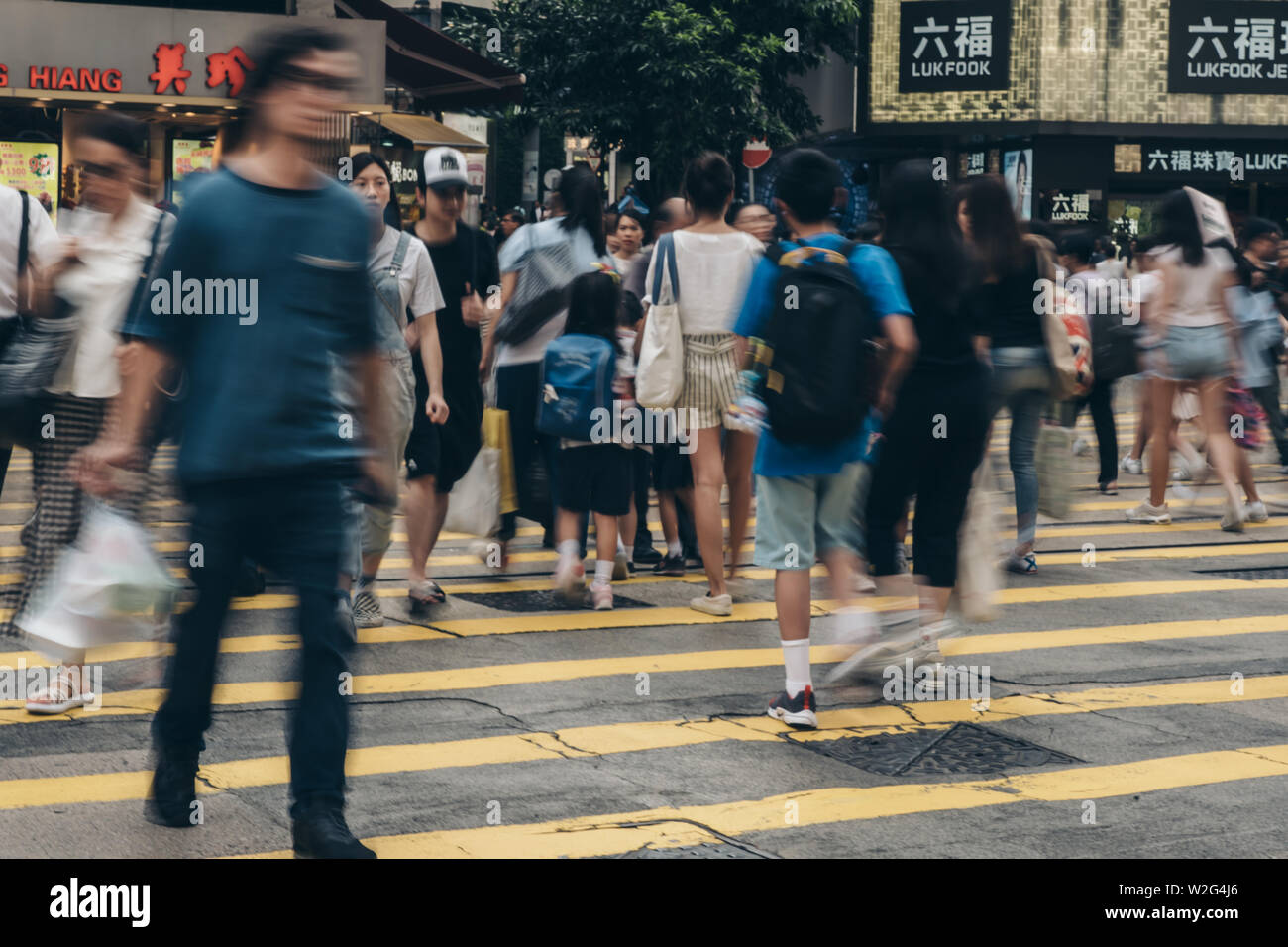 Causeway Bay, Hong Kong, 08 July 2019: Commuter in busy crosswalk ...