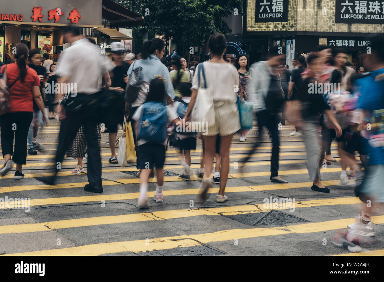 Causeway Bay, Hong Kong, 08 July 2019: Commuter in busy crosswalk ...