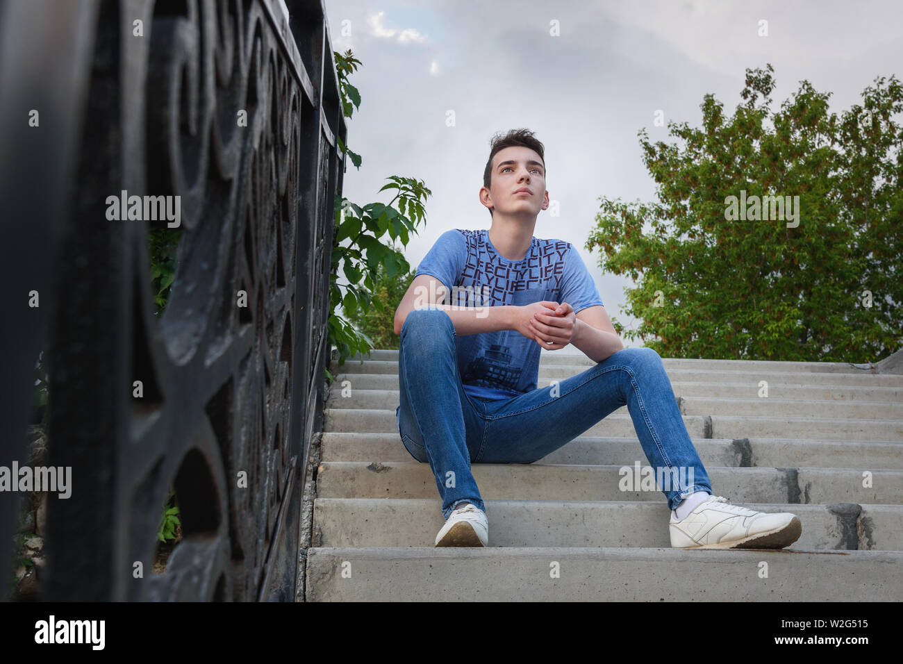 Boy on stairs hi-res stock photography and images - Alamy