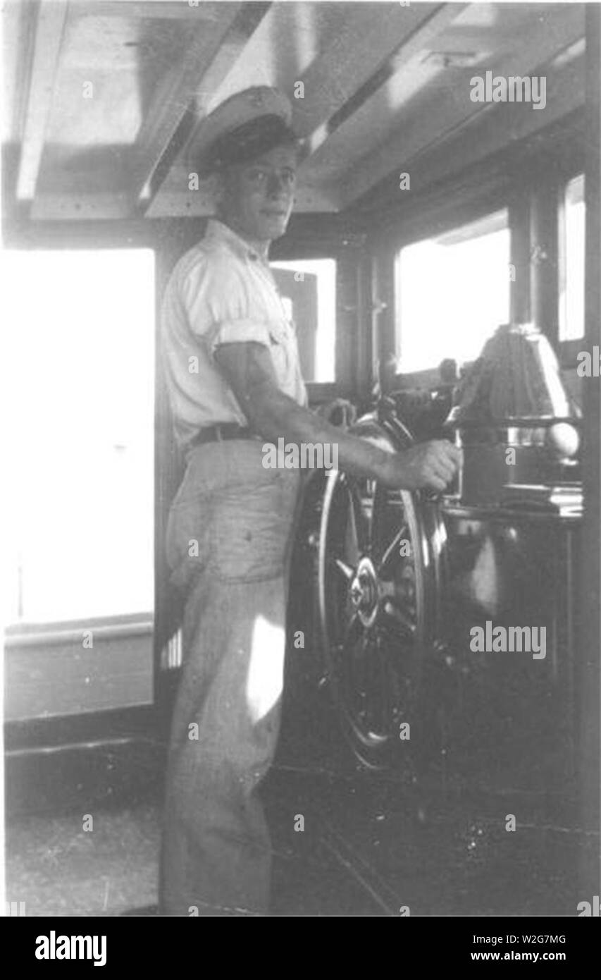 Chief Body at the wheel of the Joyita Stock Photo - Alamy