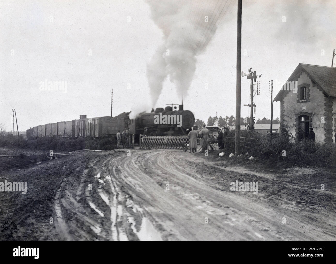 AN AMERICAN TRAIN ON WAY TO Germany passing a French Road Crossing ...