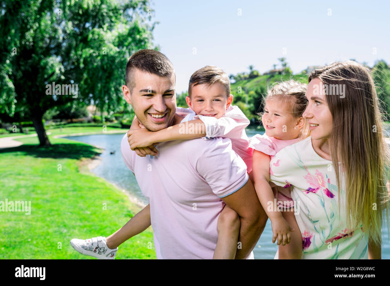Happy family at the park having a good time together Stock Photo - Alamy