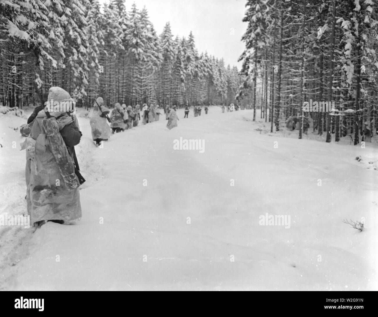 Photograph of Troops of the 82nd Airborne Division as the Move along a ...
