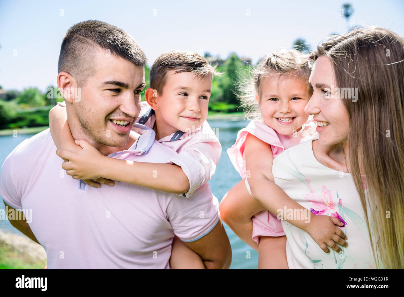 Happy family at the park having a good time together Stock Photo - Alamy