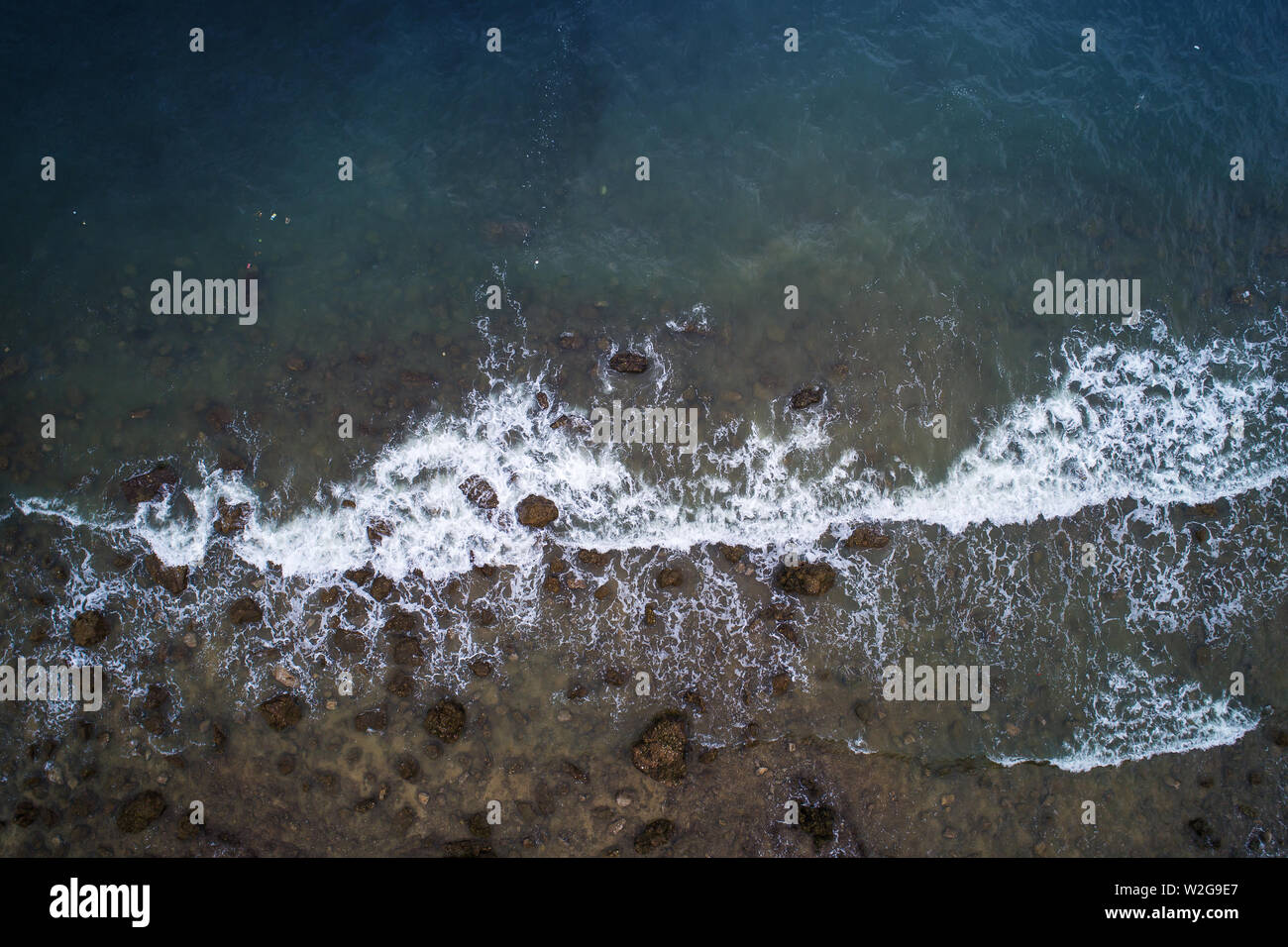 Aerial top view of ocean waves and Rock coast Stock Photo - Alamy