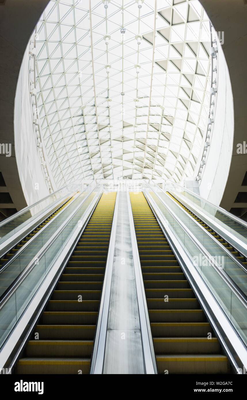 Beautiful architecture in an urban city station with escalators and ...
