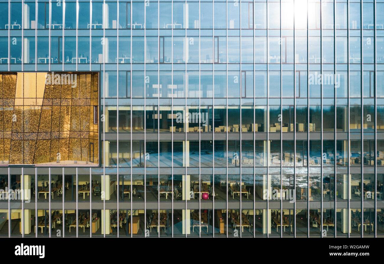 Tall glass business building in an urban city Stock Photo - Alamy