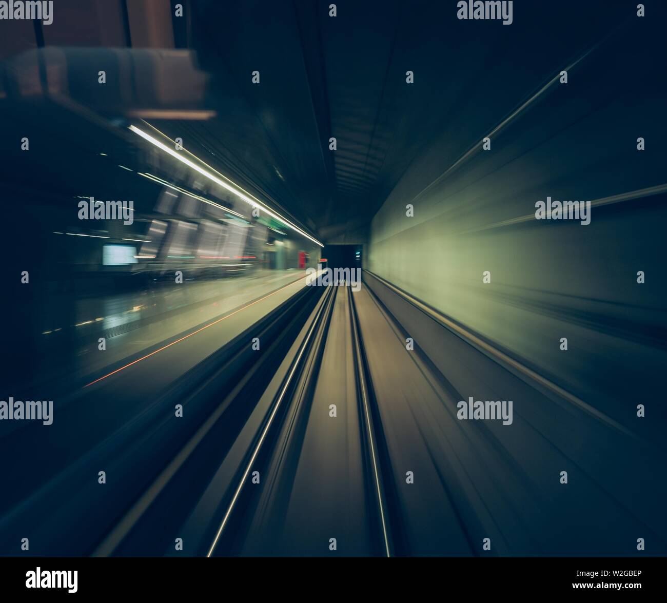 Fast movement of a train through railway tunnels captured from inside ...