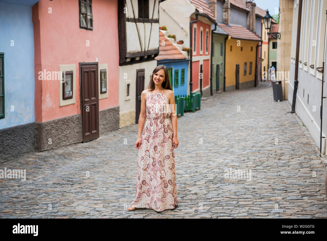 Cobblestone street and colorful 16th century cottages of artisans known ...