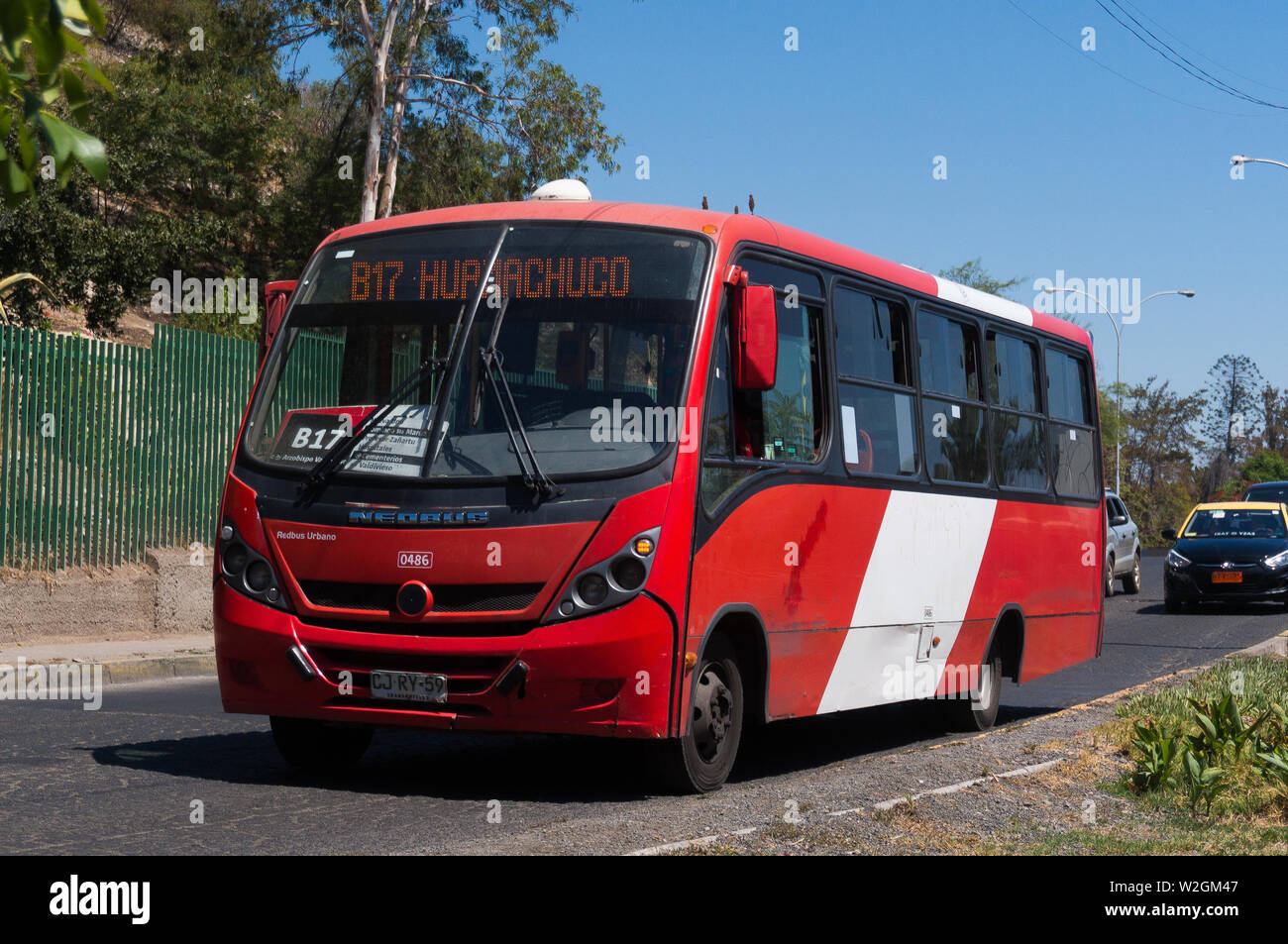 SANTIAGO, CHILE - MARCH 2017: A small red Transantiago bus in downtown ...
