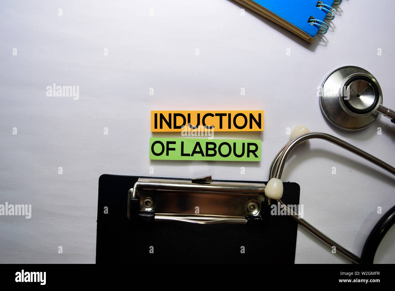 Induction of Labour text on top view isolated on white background ...