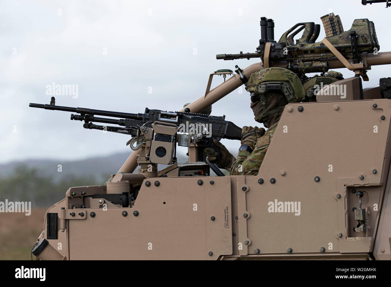 ROCKHAMPTON, Australia -- An Australian Soldier aboard a High Mobility ...