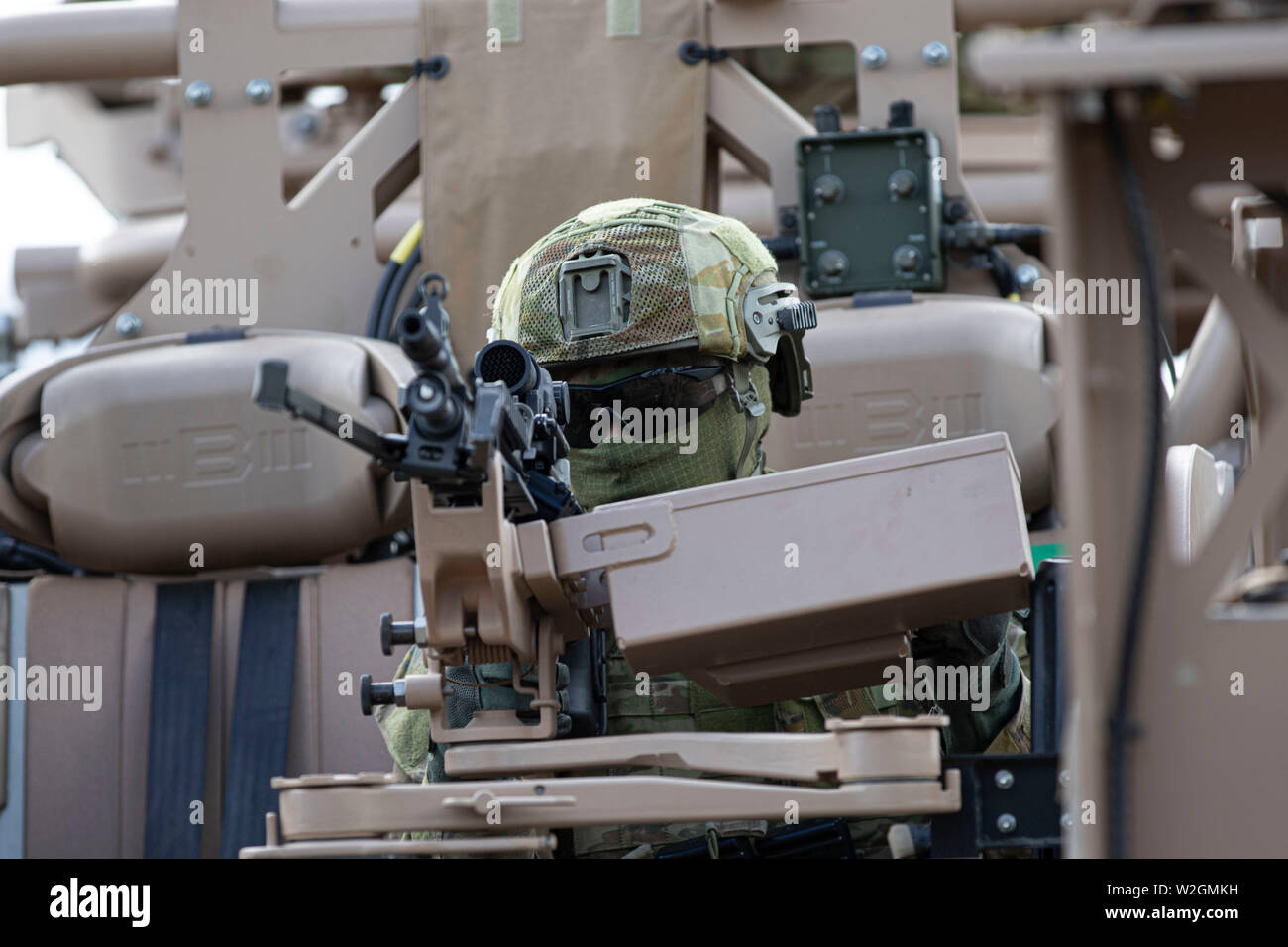 ROCKHAMPTON, Australia -- An Australian Soldier aboard a High Mobility ...