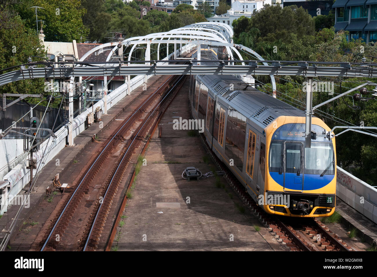 Sydney Australia, train approaching along suburban train track Stock ...