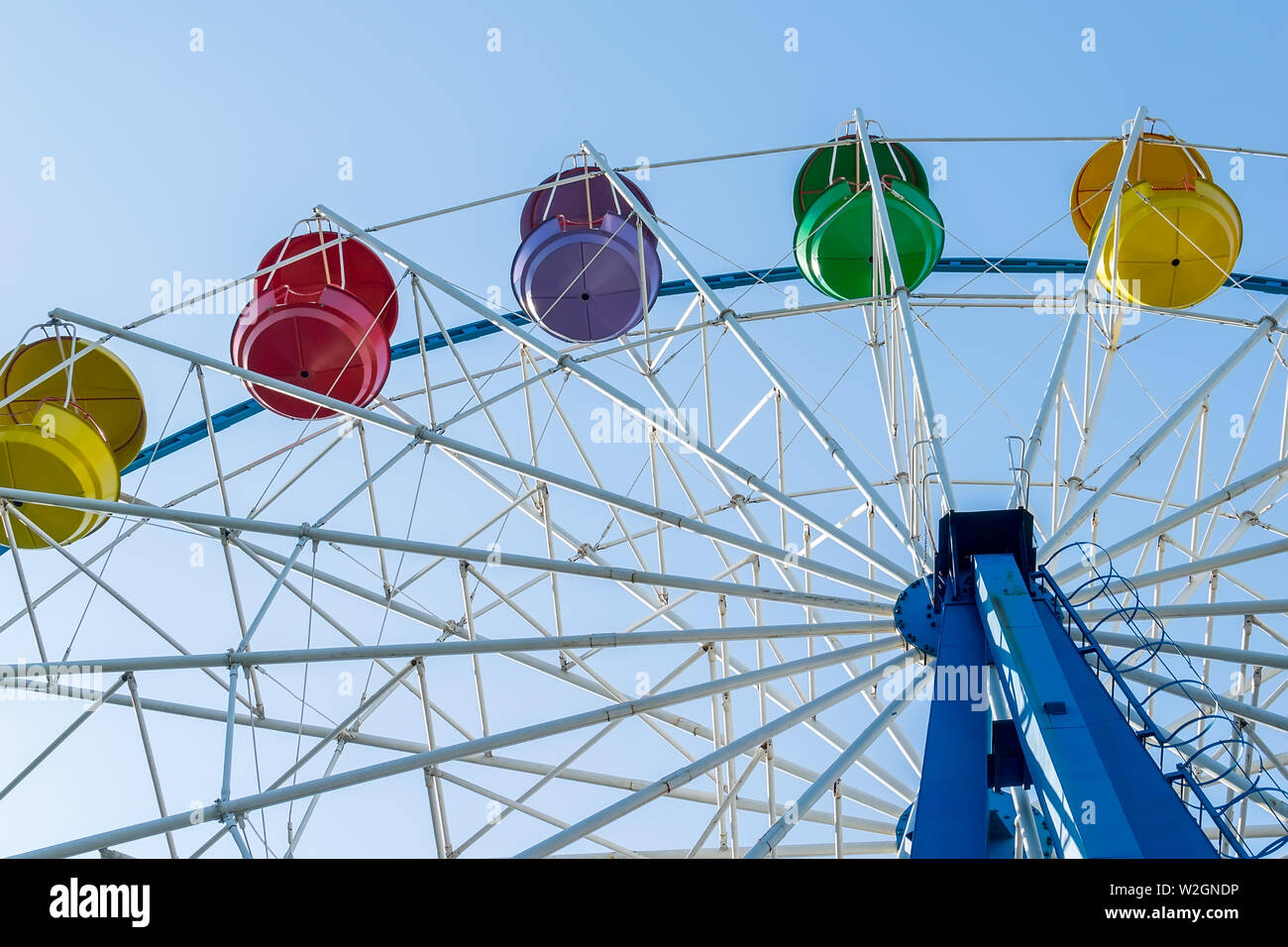 ferris wheel from the amusement Park with colorful baskets of seats ...