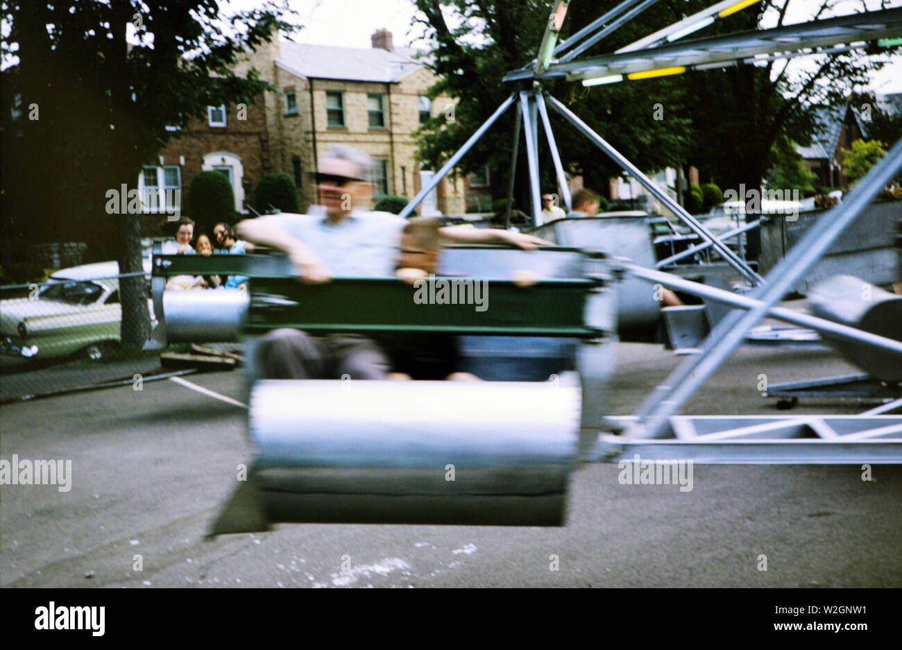 Riders on scrambler carnival ride hi-res stock photography and images ...