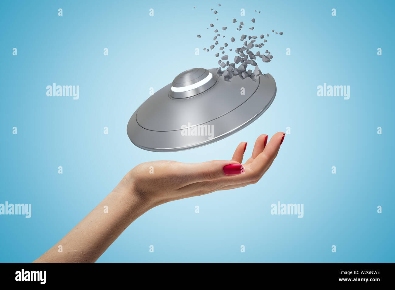 Closeup of woman's hand and little UFO above her palm, one side of UFO ...
