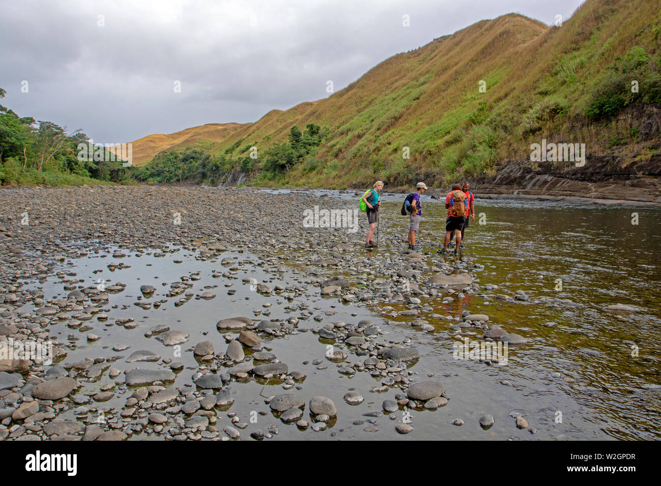 Hikers crossing the Ba River Stock Photo - Alamy