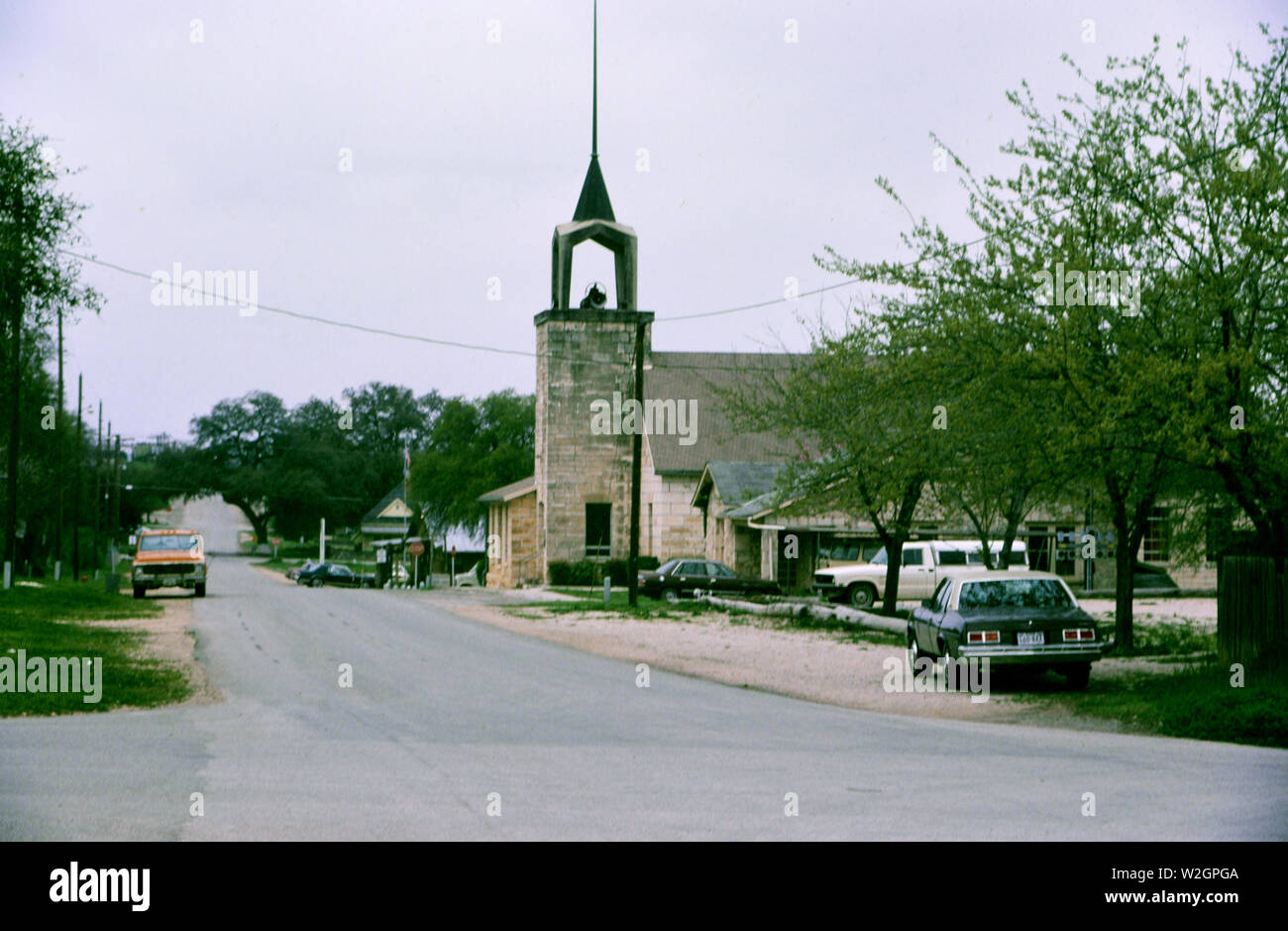 Residential street with a church and parked cars ca. 1987 Stock Photo ...