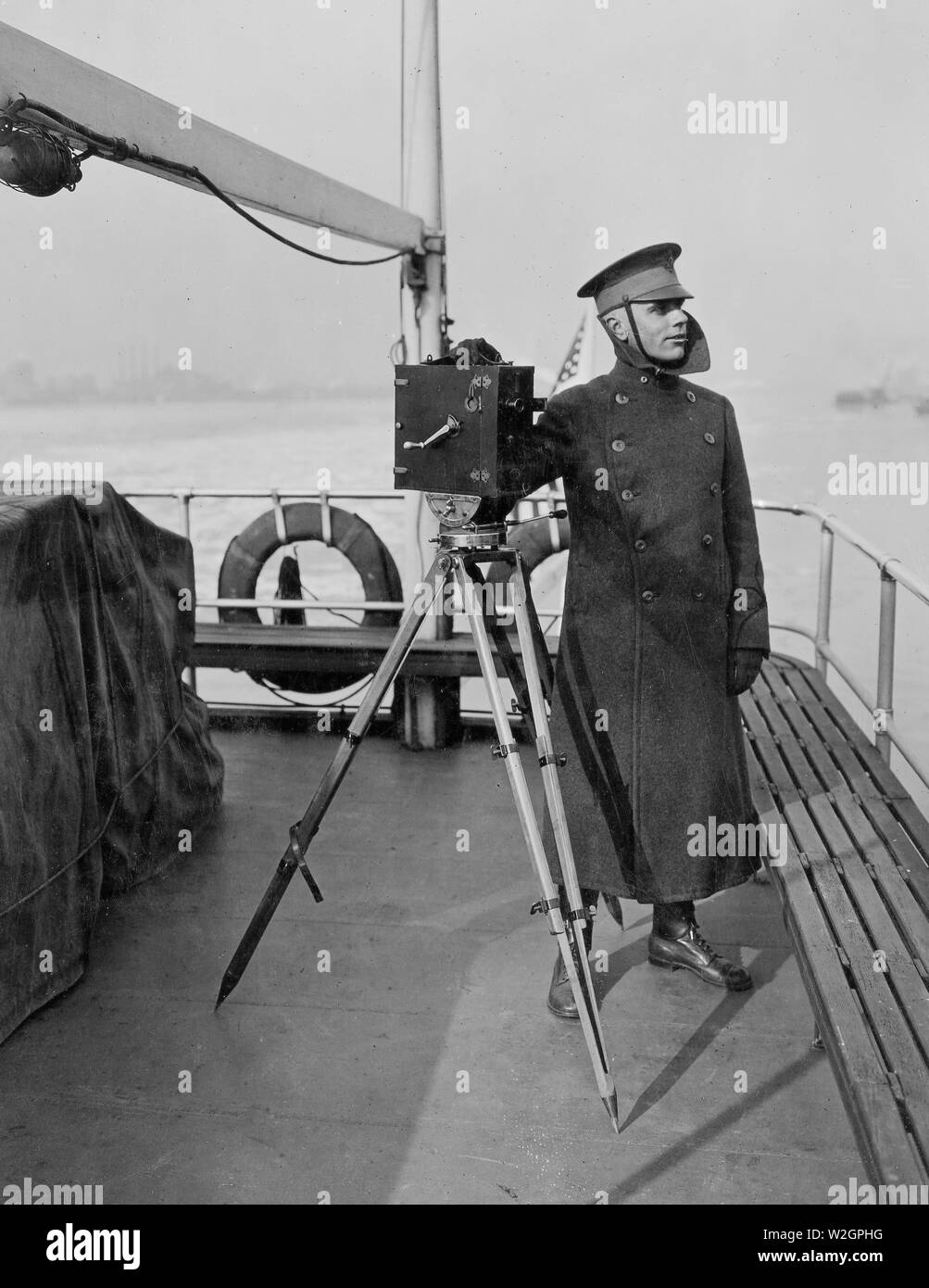 Photographer on deck of vessel to take a photo of ship being launched ...