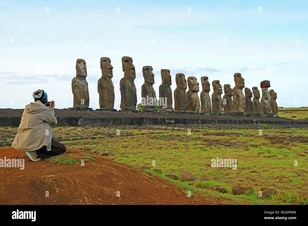Man photographing the 15 huge Moai statues of Ahu Tongariki ...