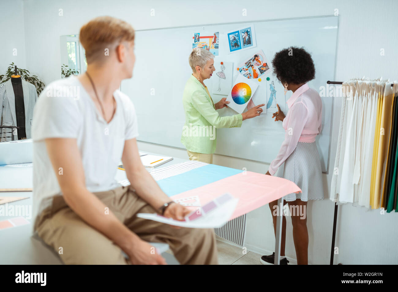 Two designers. Two woman fashion designers standing in front of the ...