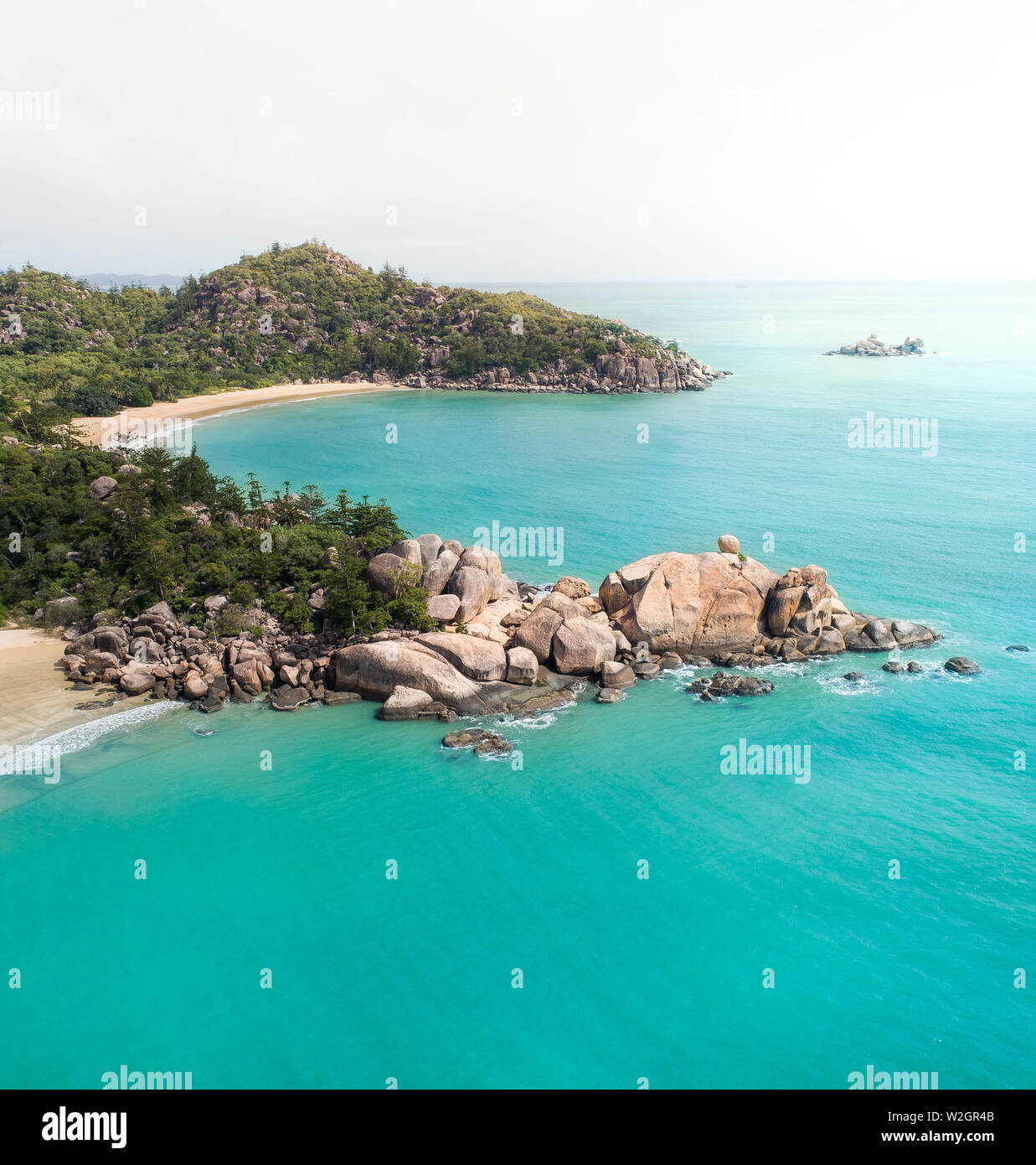 Aerial views over a tropical island in a middle of an archipelago ...