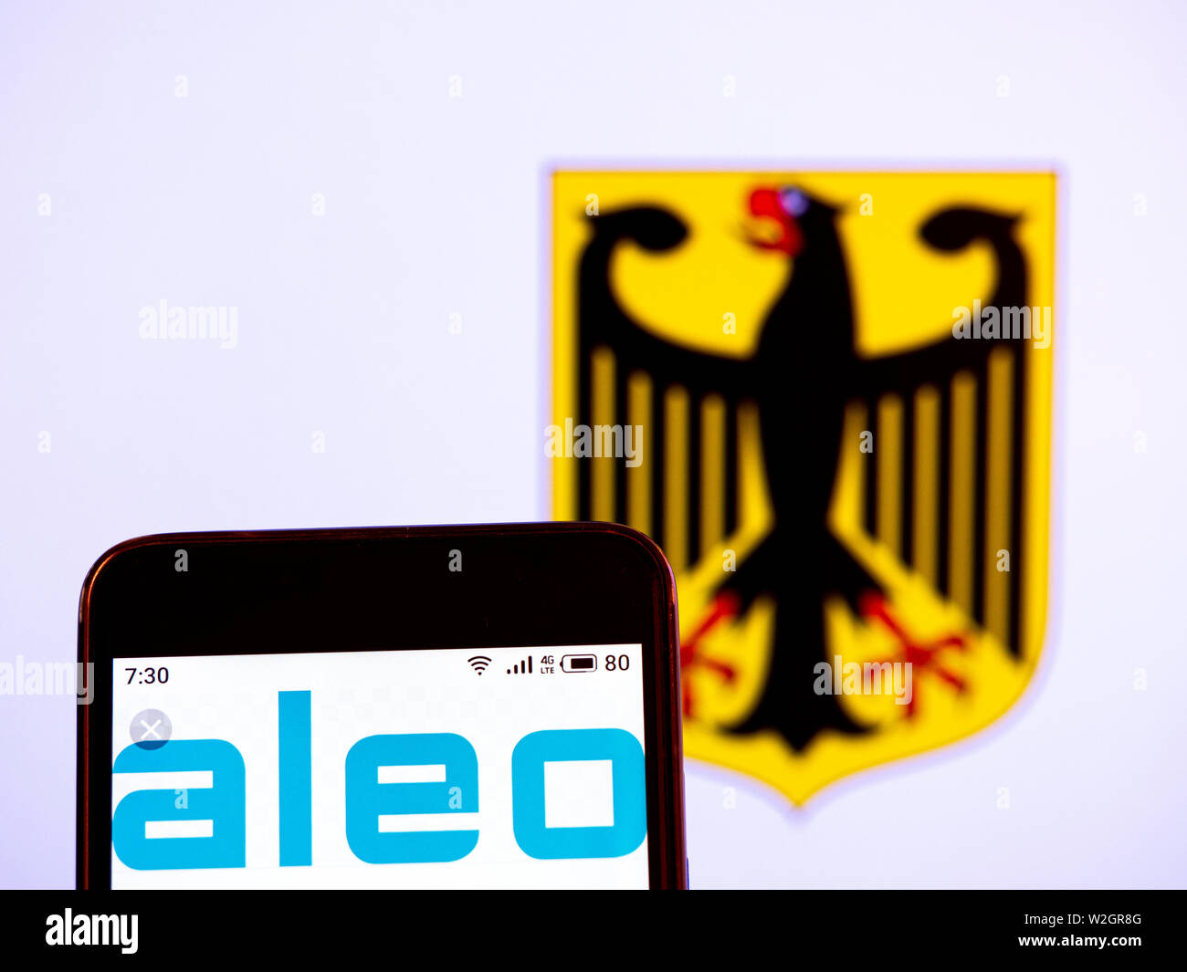 In this photo illustration the Aleo Solar logo is seen displayed on a ...