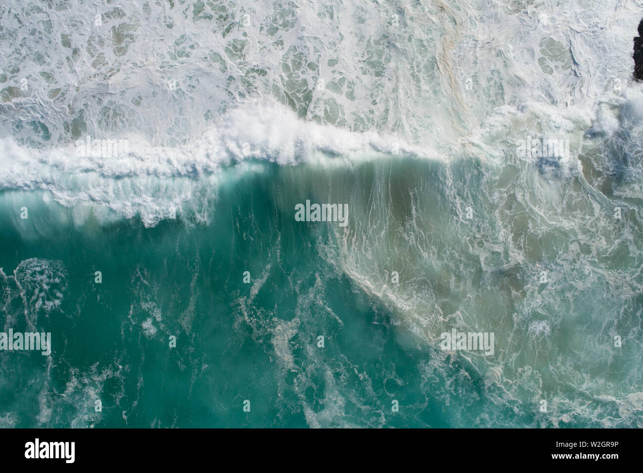 Aerial view of a waves crashing and rolling in the ocean. Storm looking ...