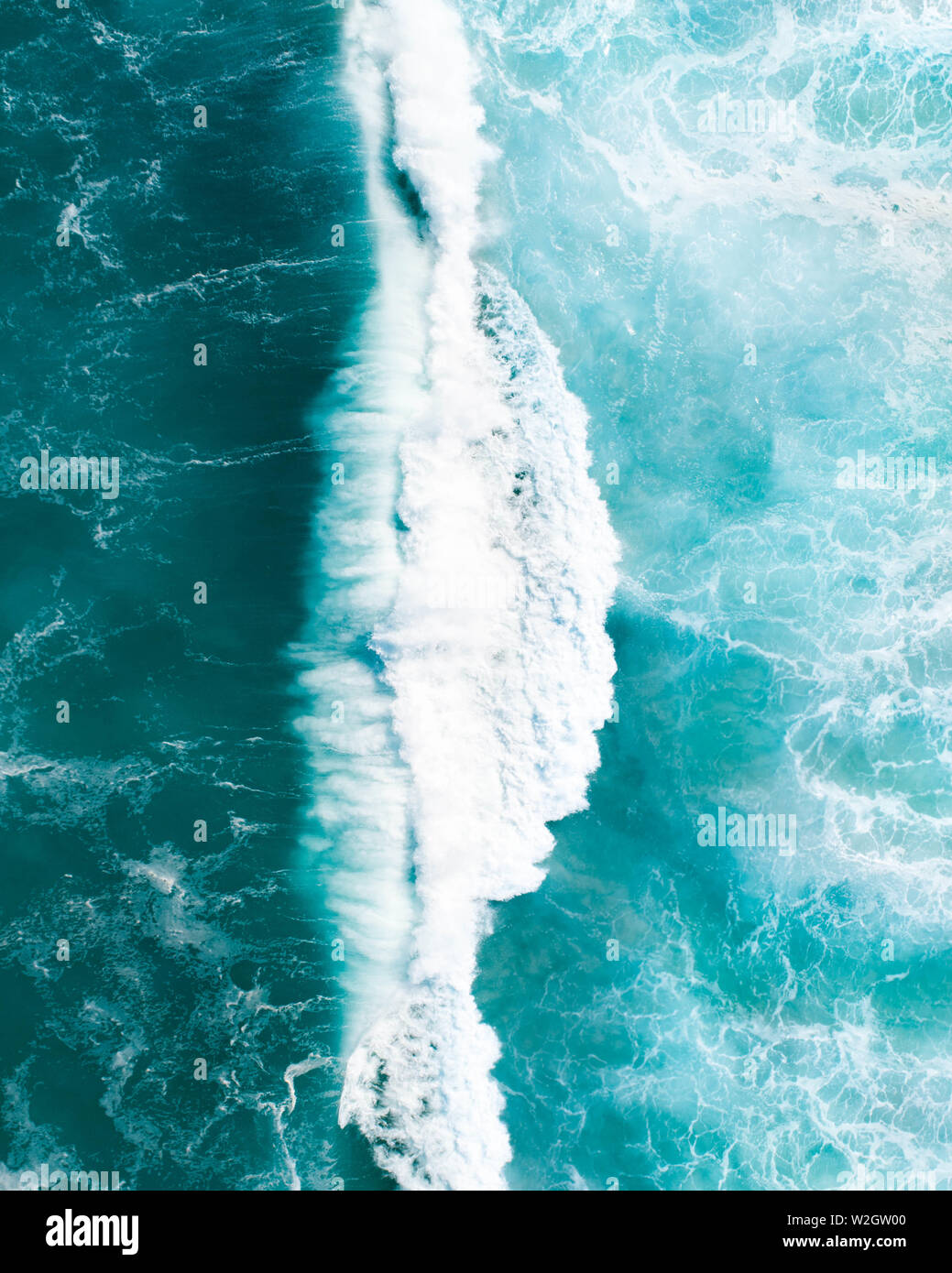 Aerial view of a waves crashing and rolling in the ocean. Storm looking ...