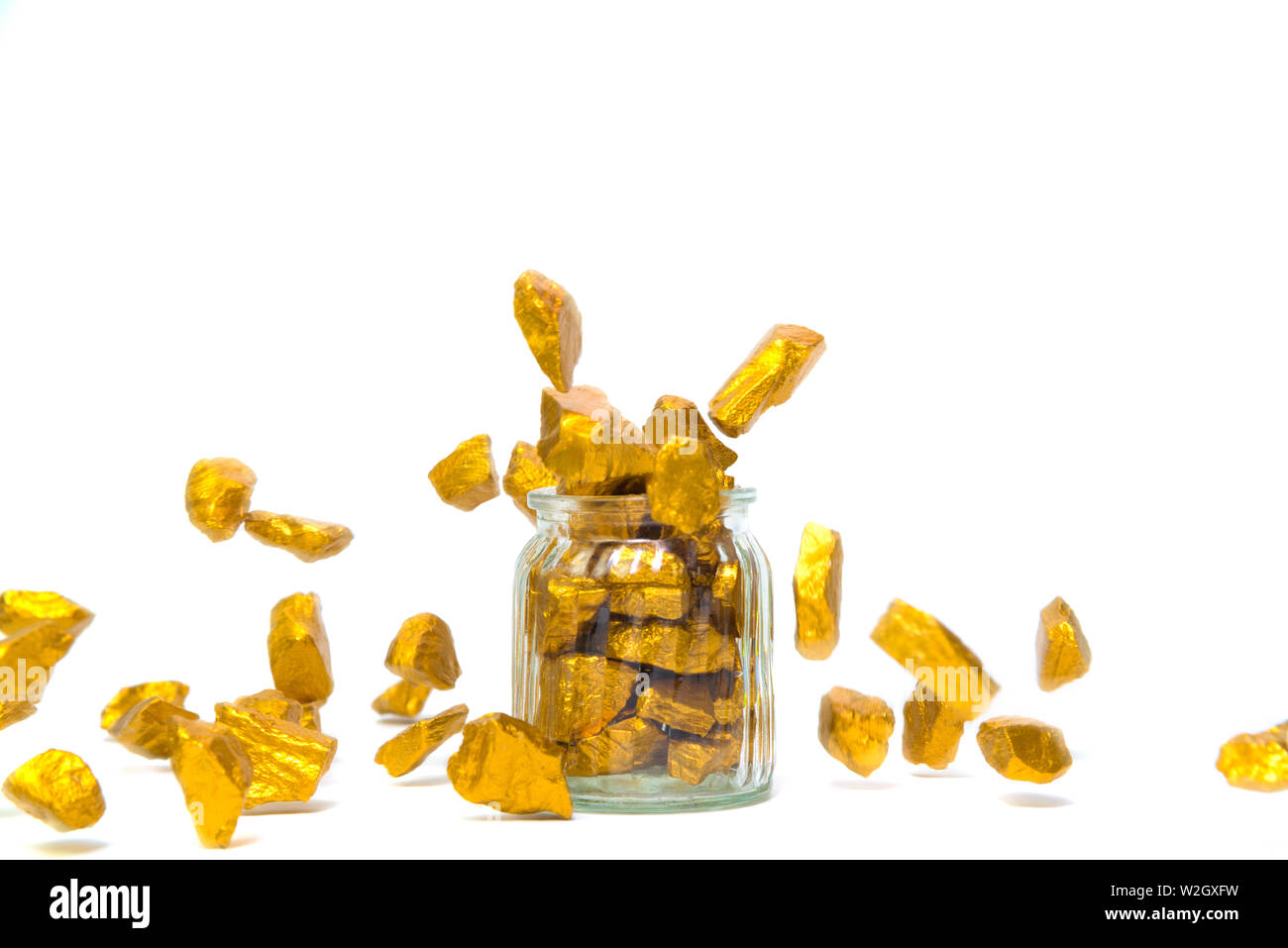 Falling gold nuggets, gold ore , precious stone or lump of golden stone ...