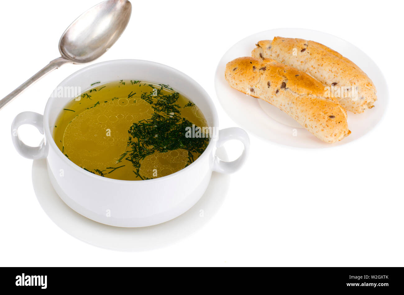 Hot meat broth with fresh cereal bun Stock Photo - Alamy