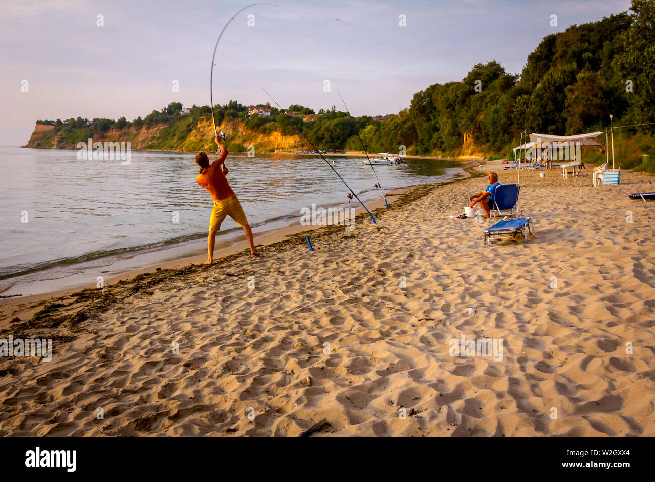 Two men fishing from a beach hi-res stock photography and images - Alamy