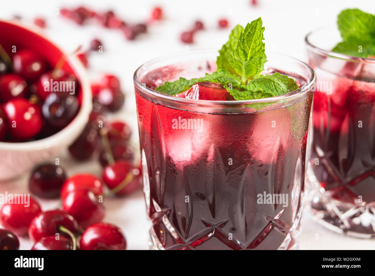 Fresh Cherry Juice in Glasses With Mint Leaves and Ice Cubes, and Fresh ...
