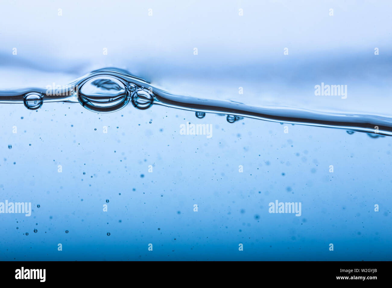 Water splash, clear blue water with waves and bubbless Stock Photo - Alamy