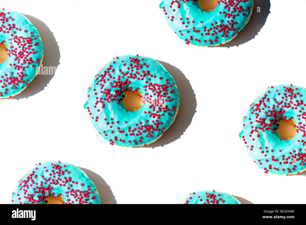 Bright blue donuts on a white isolated background Stock Photo - Alamy