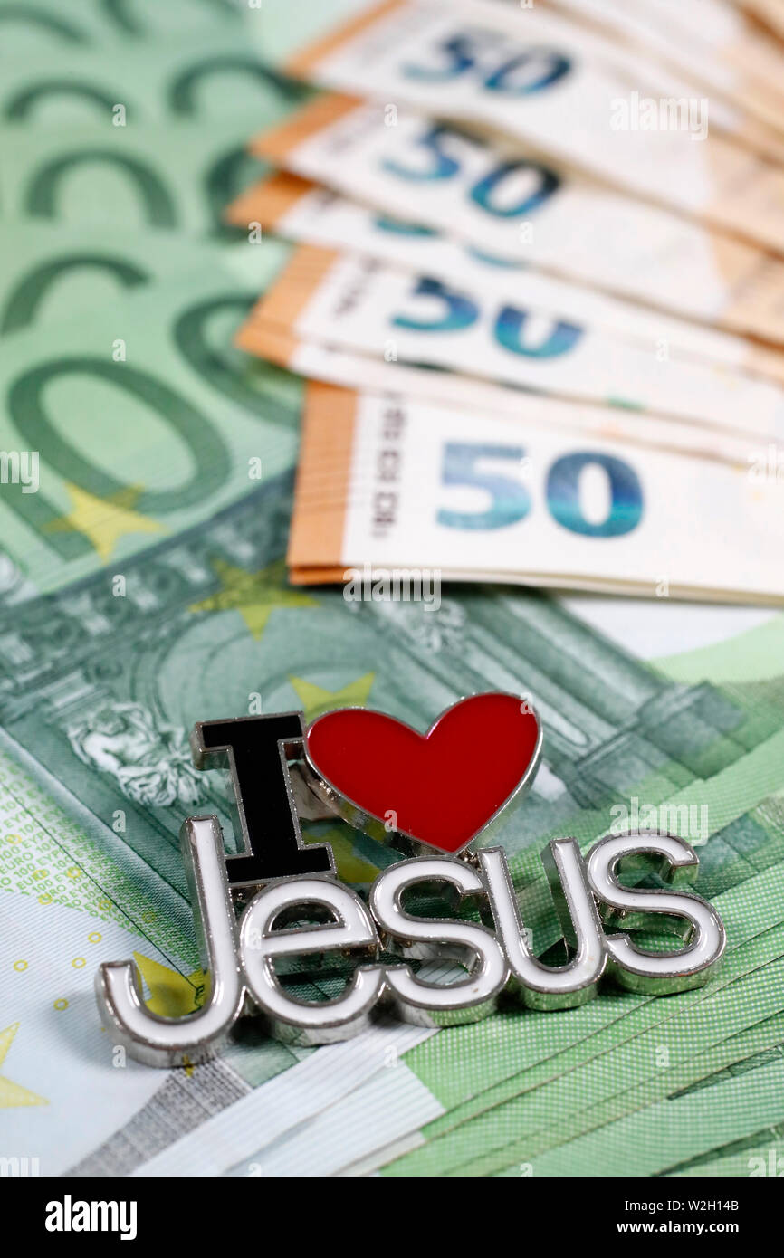 Catholic finance and economy concept with I love Jesus pins. Banknotes ...