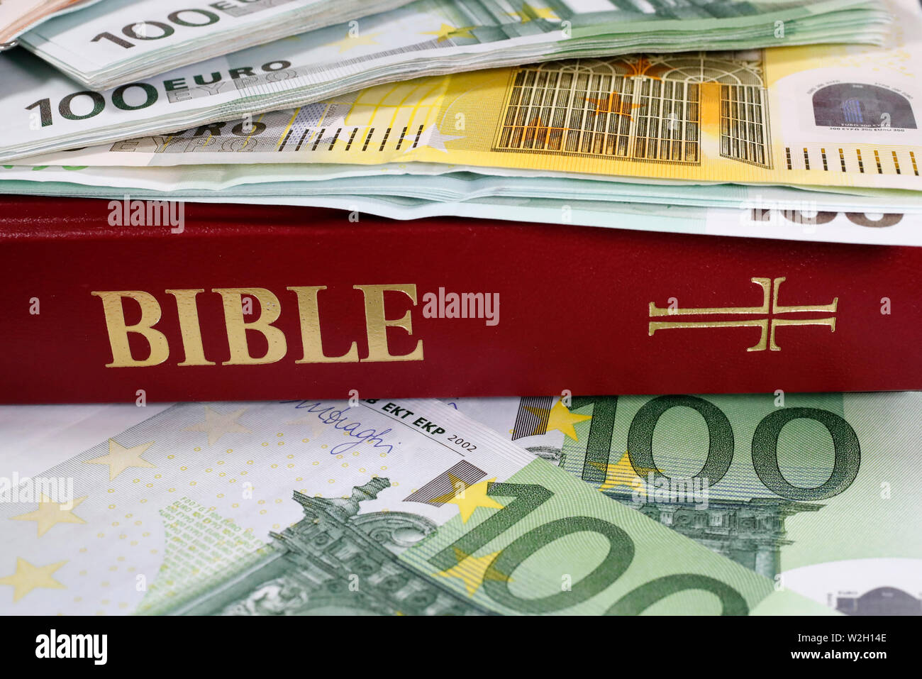 Catholic finance and economy concept with bible. Banknotes of euro ...
