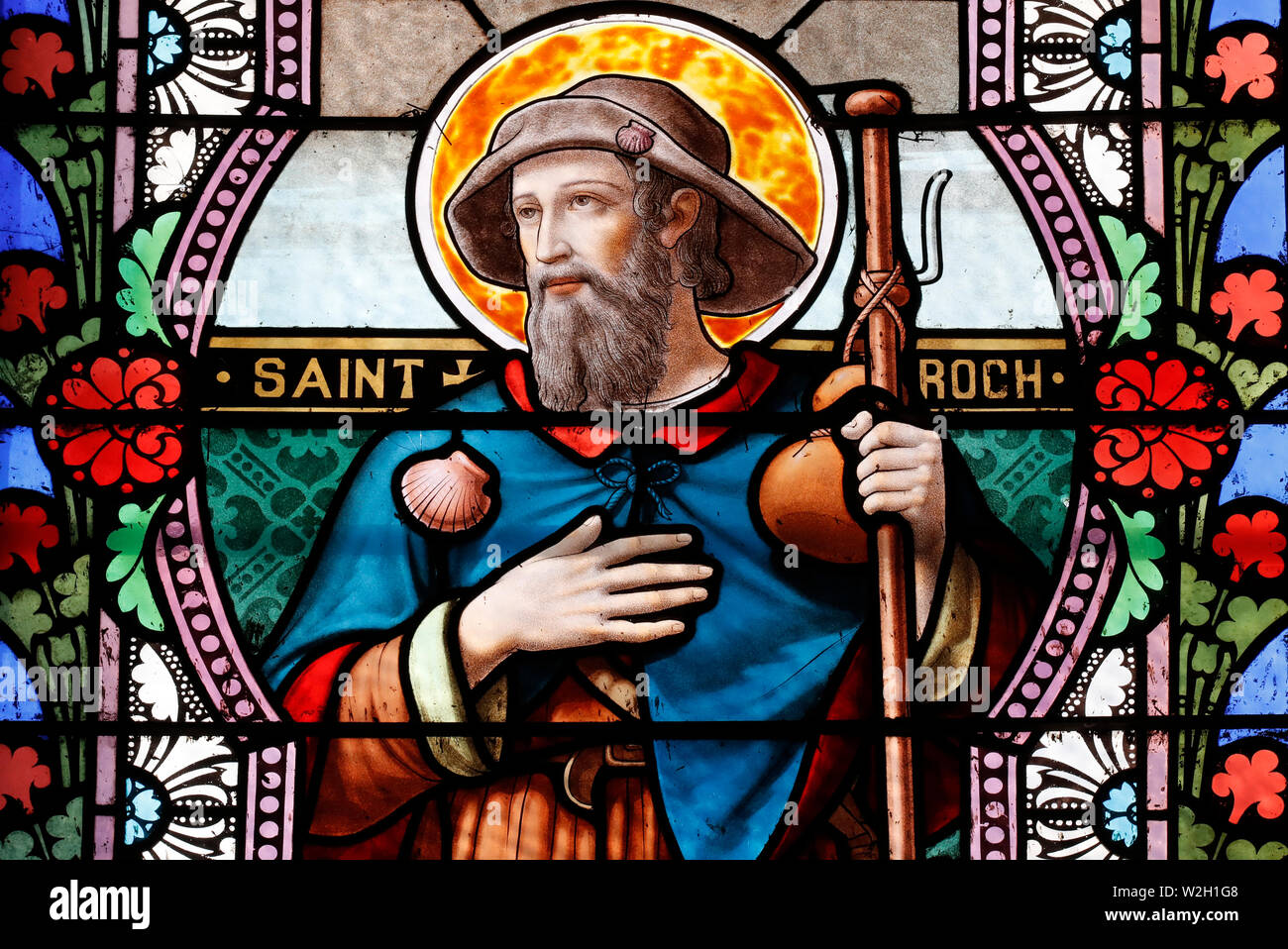 Saint Roch. He is a patron saint of dogs. Stained glass window ...