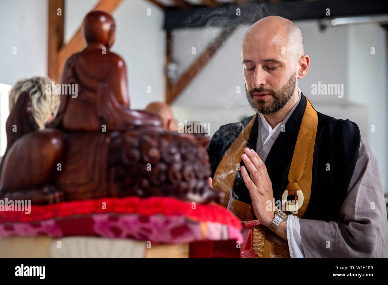 Zen sesshin (retreat) in Paris, France. Master performing a ritual ...
