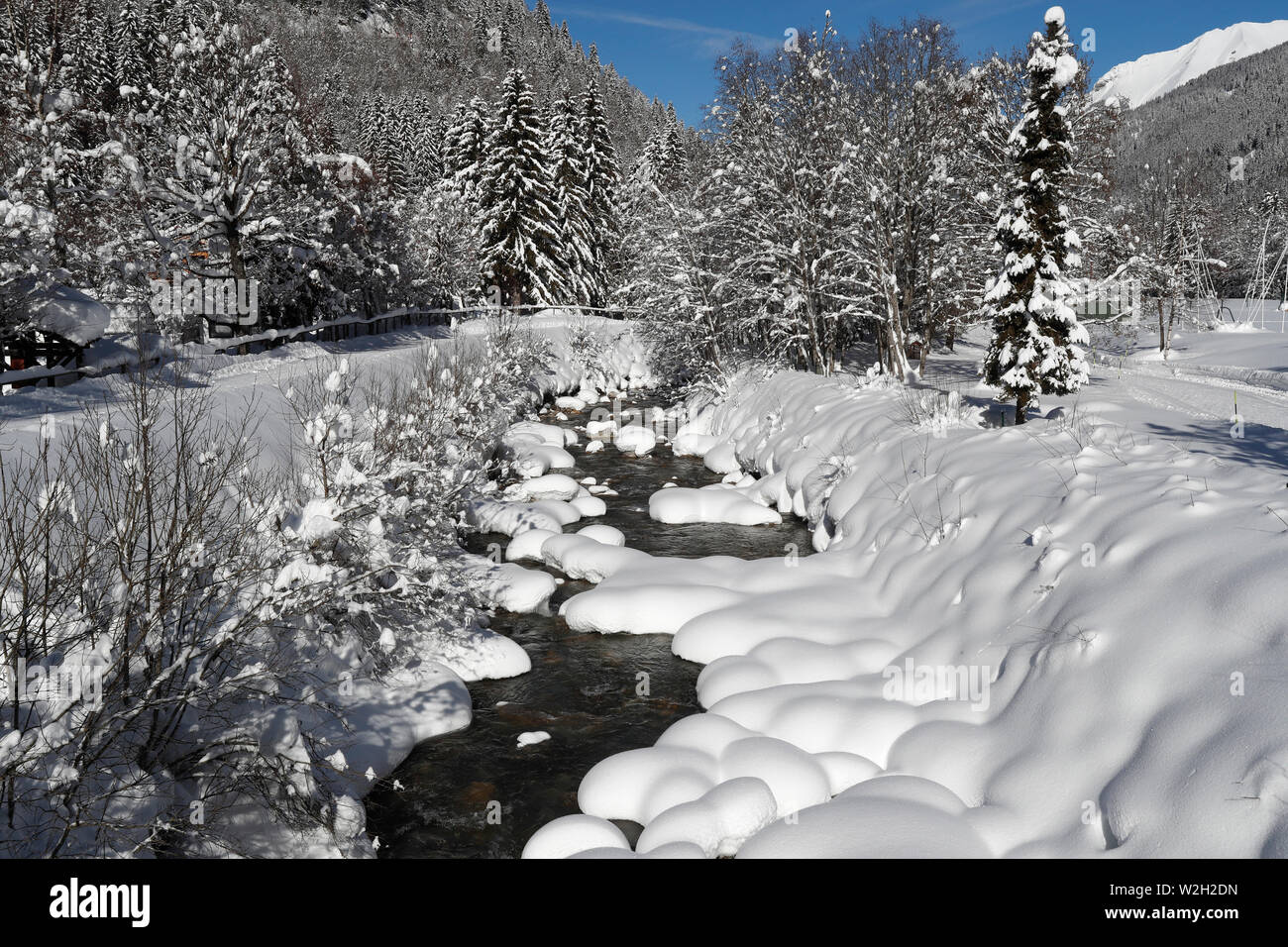 Mont blanc massif in winter. River and snow. Les Contamines. France ...