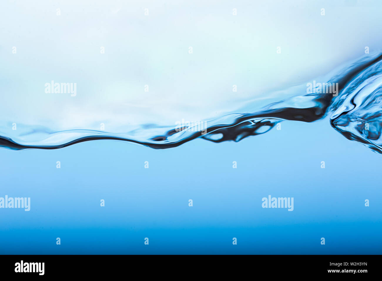 Water splash, clear blue water with waves and bubbless Stock Photo - Alamy