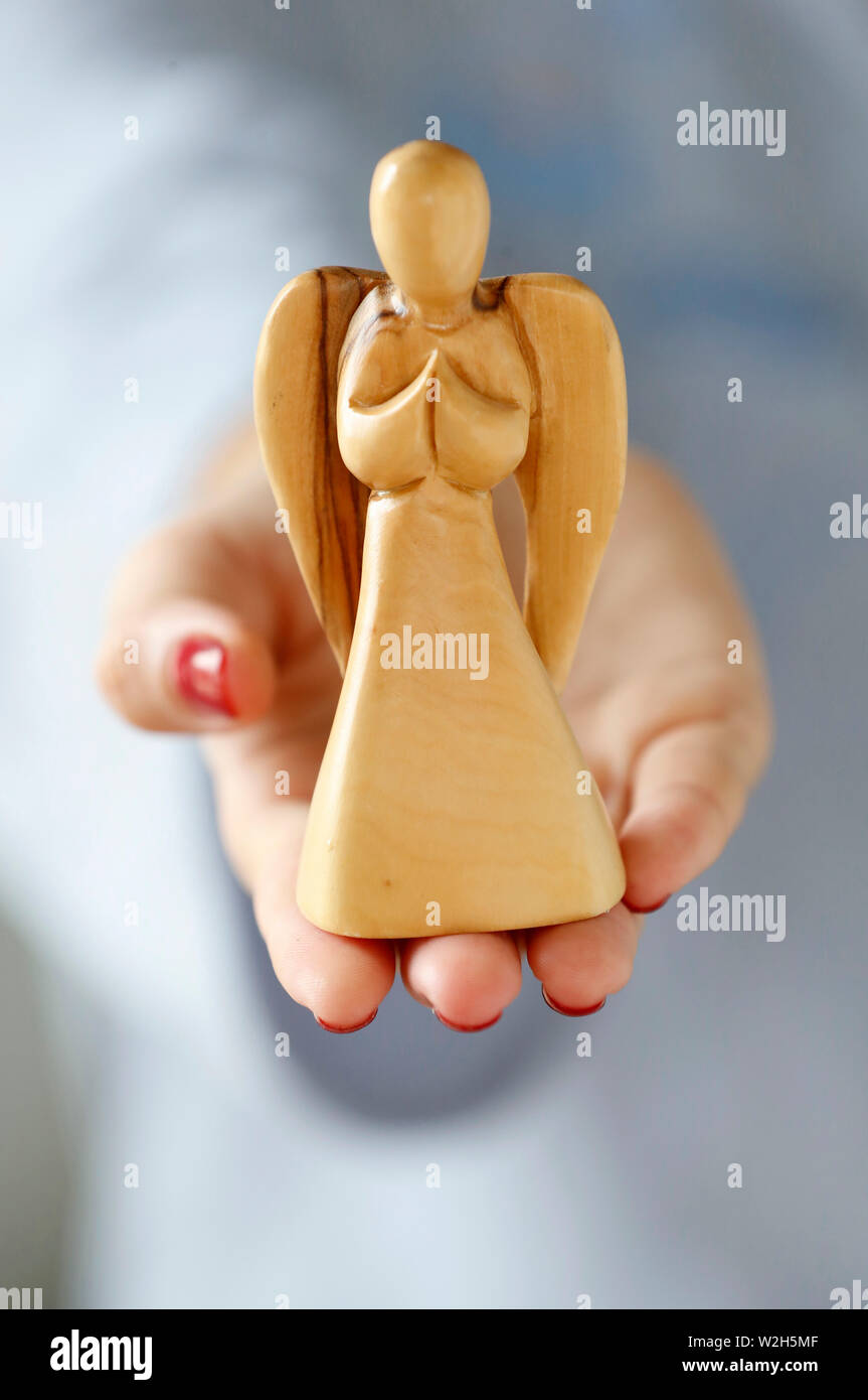 Hand holding angel hi-res stock photography and images - Alamy