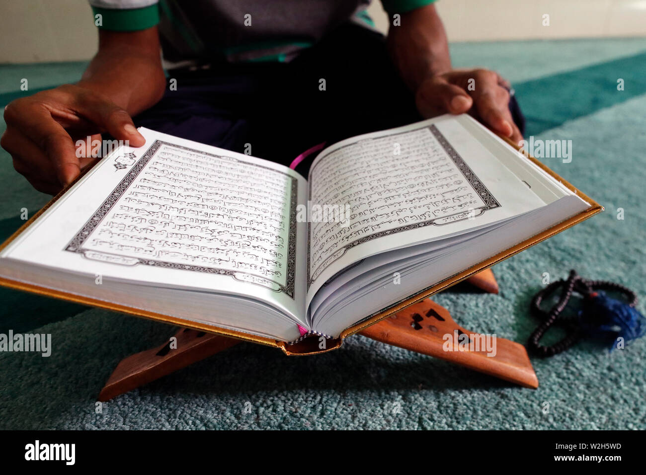 Muslim reading the Quran in mosque. Ho Chi Minh city. Vietnam Stock ...