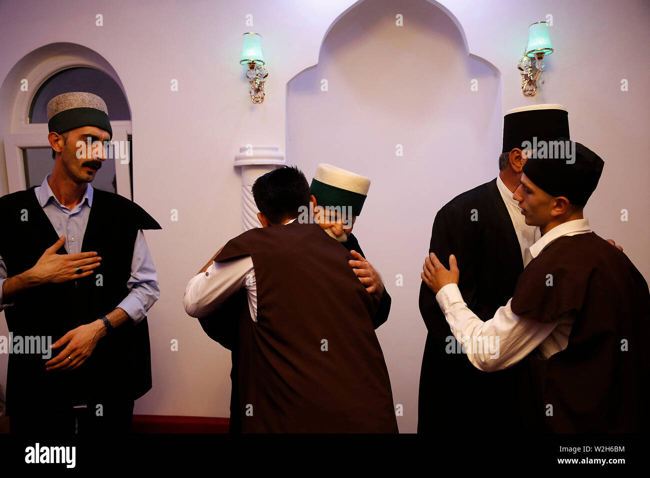 Halvetiye sufi tariqa zikhr in Gjakova, Kosovo. Hugging Stock Photo - Alamy